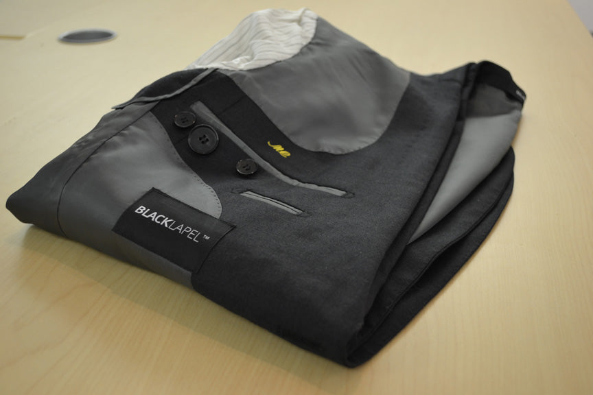 How to Pack a Suit — 4 Simple Steps to Fold a Suit Properly | Black Lapel
